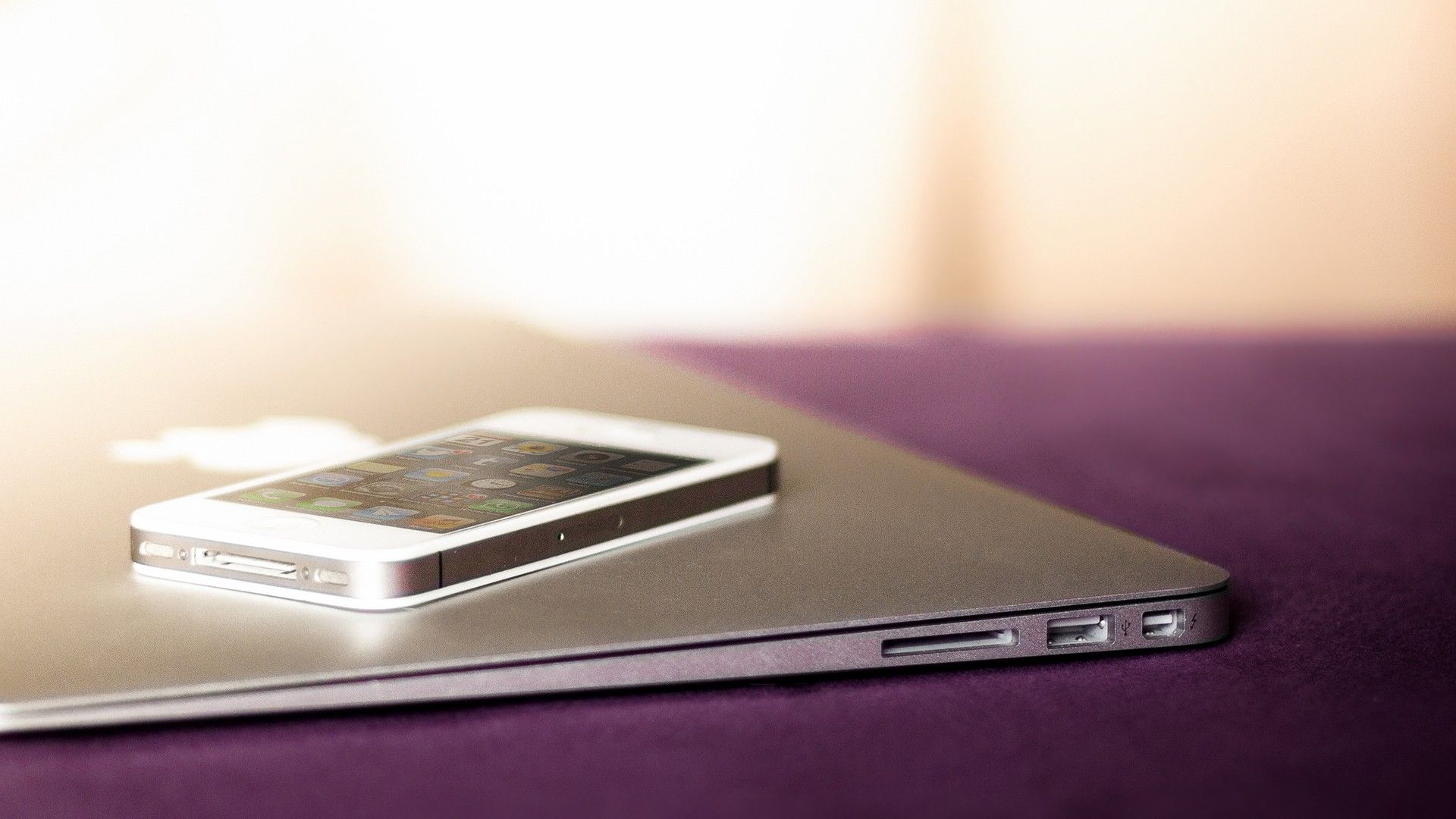 Iphone on a macbook air wallpaper jpg